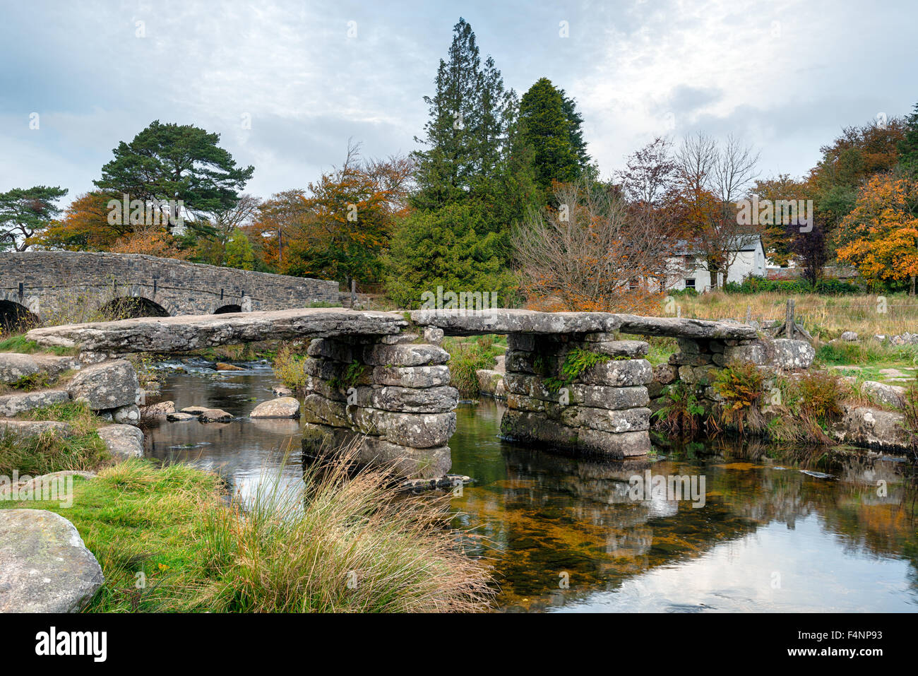 An ancient granite clapper bridge crossing the East Dart river at ...