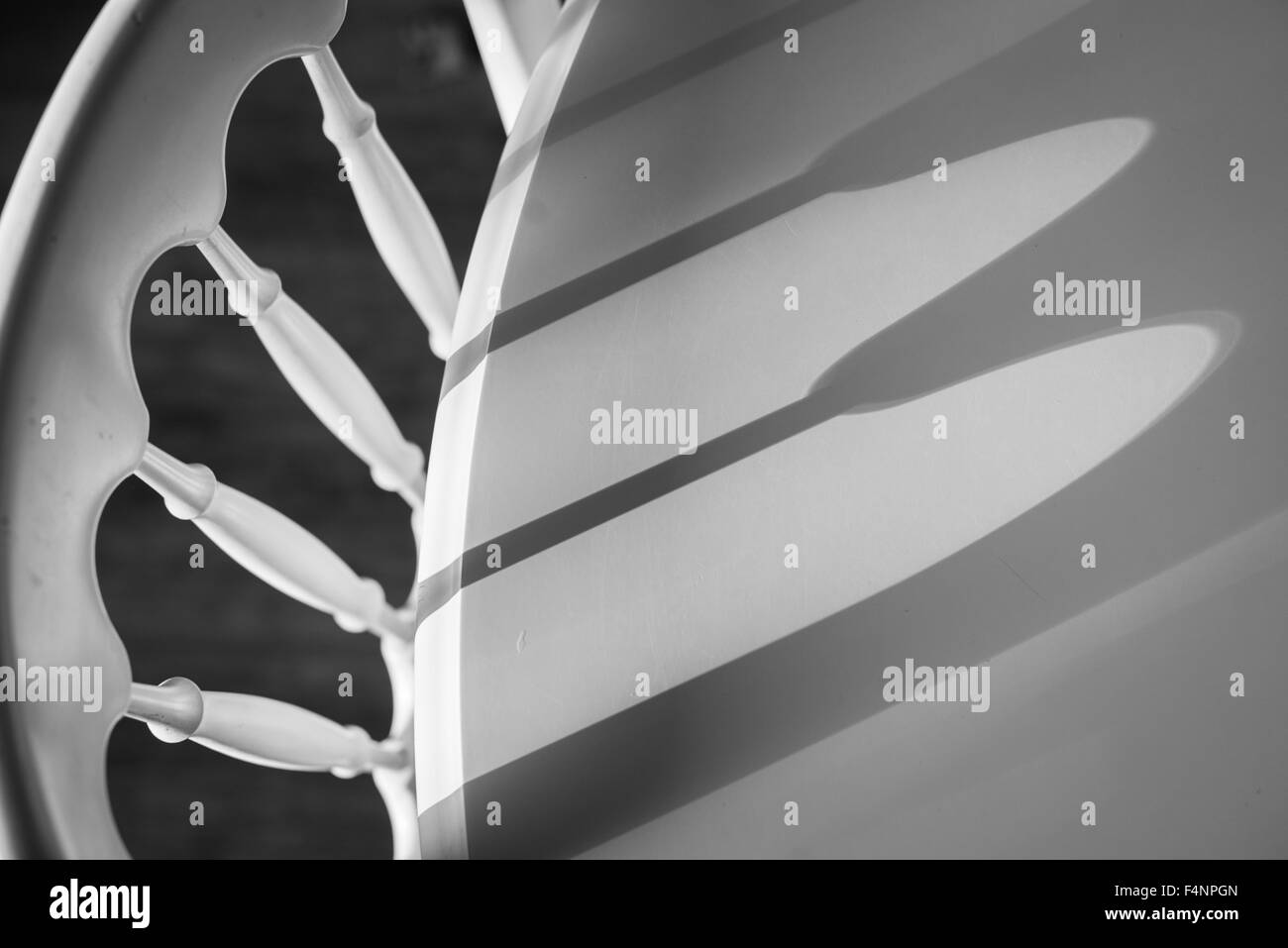 Shadow cast by chair in black and white Stock Photo - Alamy