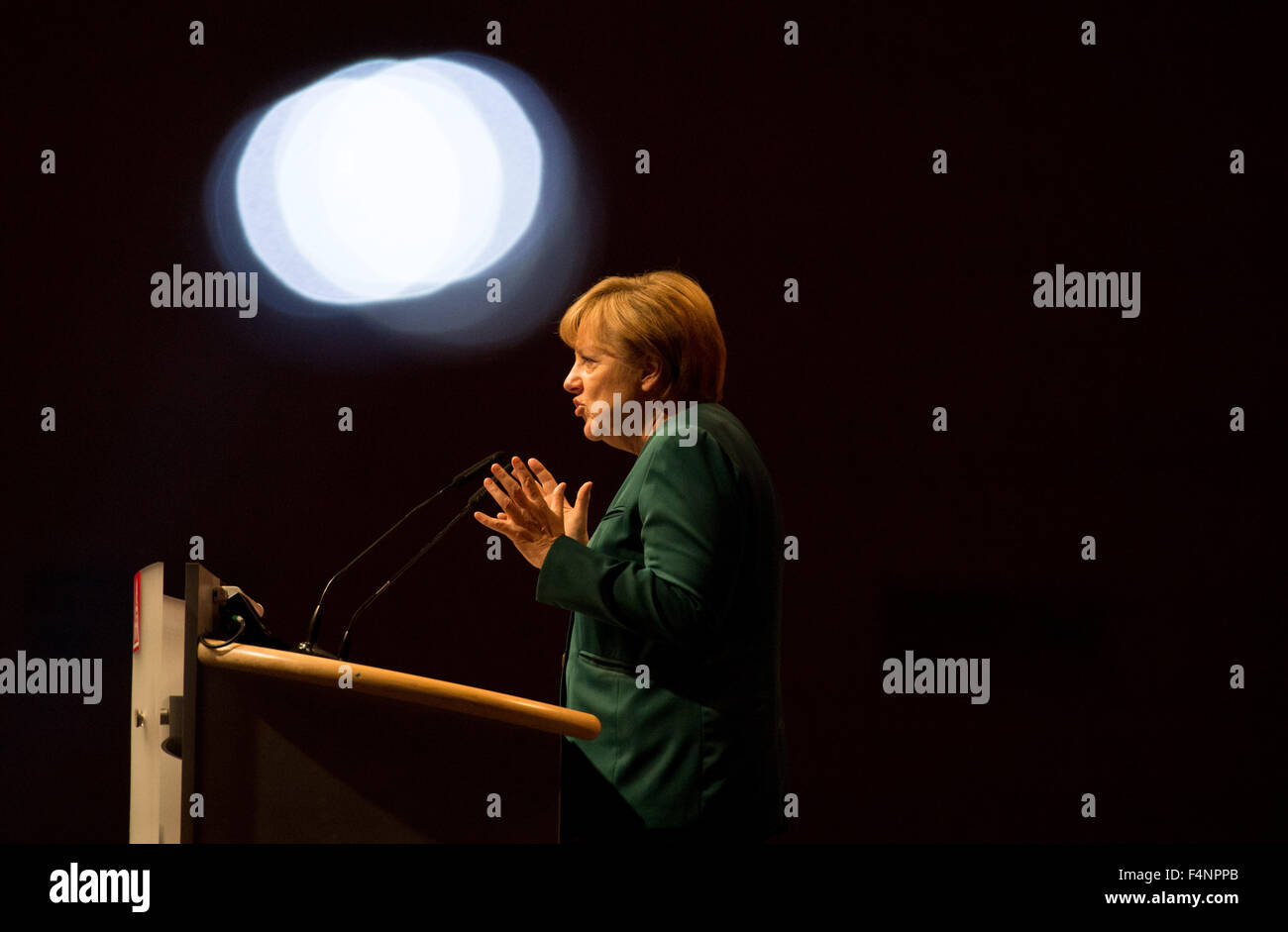 German Chancellor Angela Merkel gives a lecture at the podium under the ...