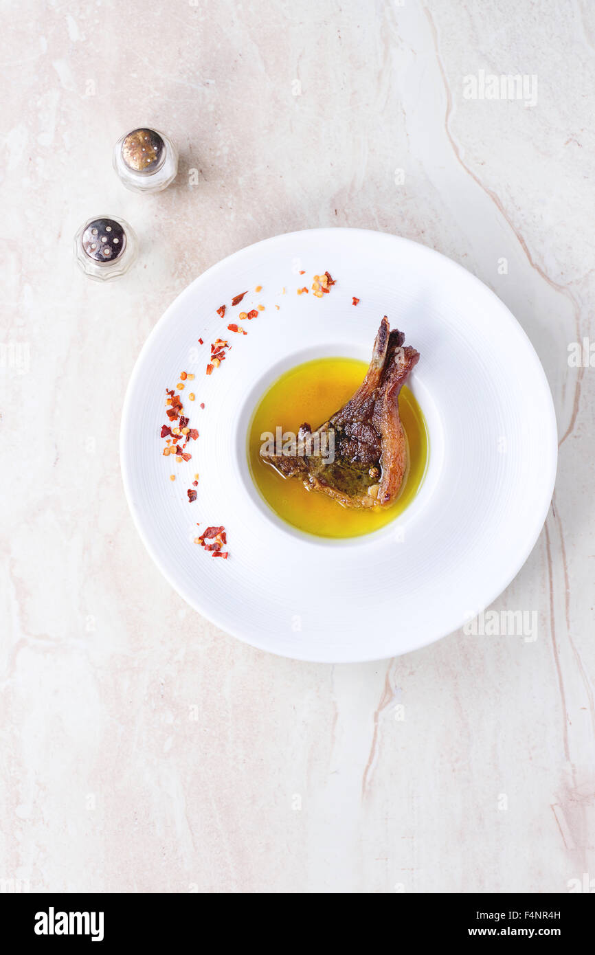Well done grilled lamb chop Stock Photo - Alamy
