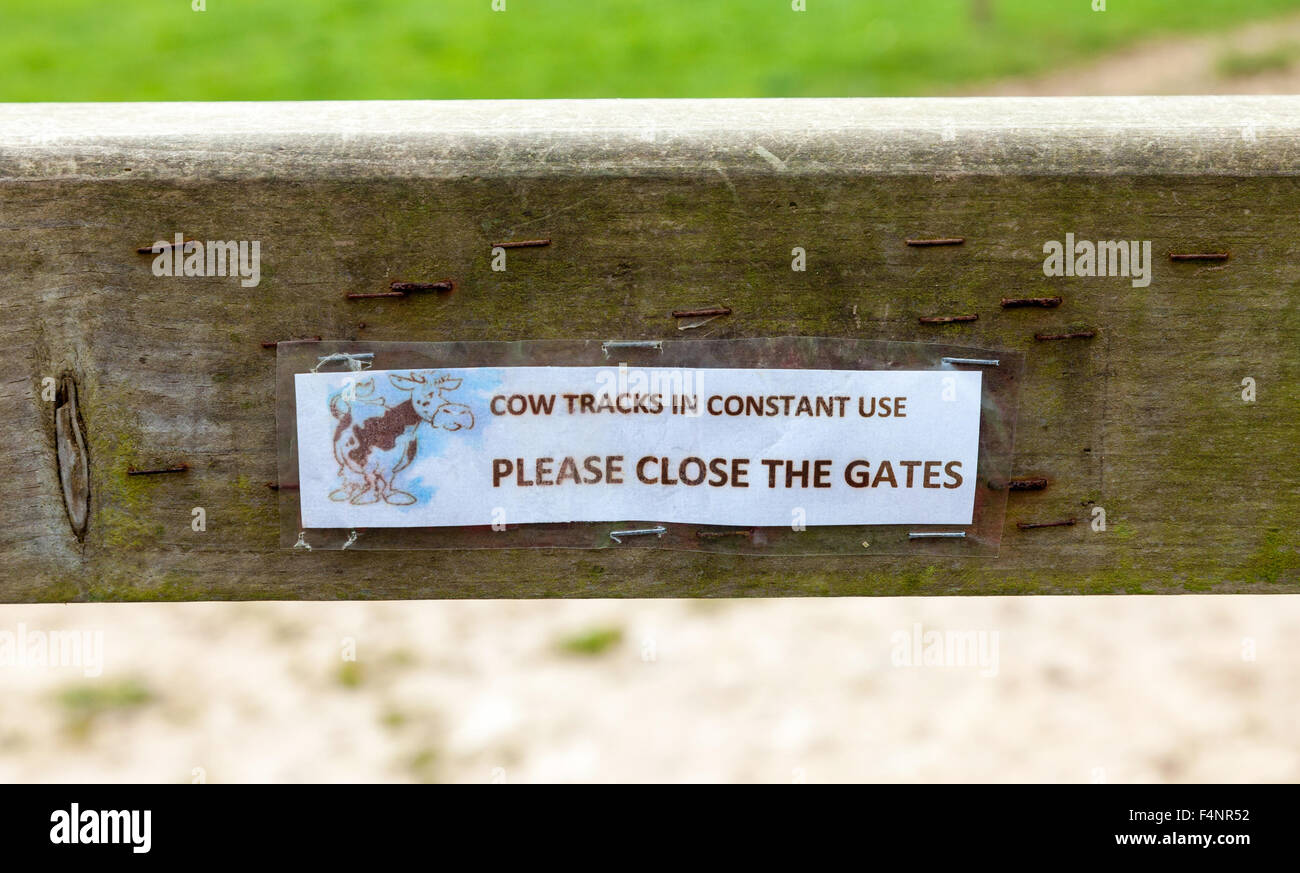 A sign saying cow tracks in constant use please close the gates Stock ...