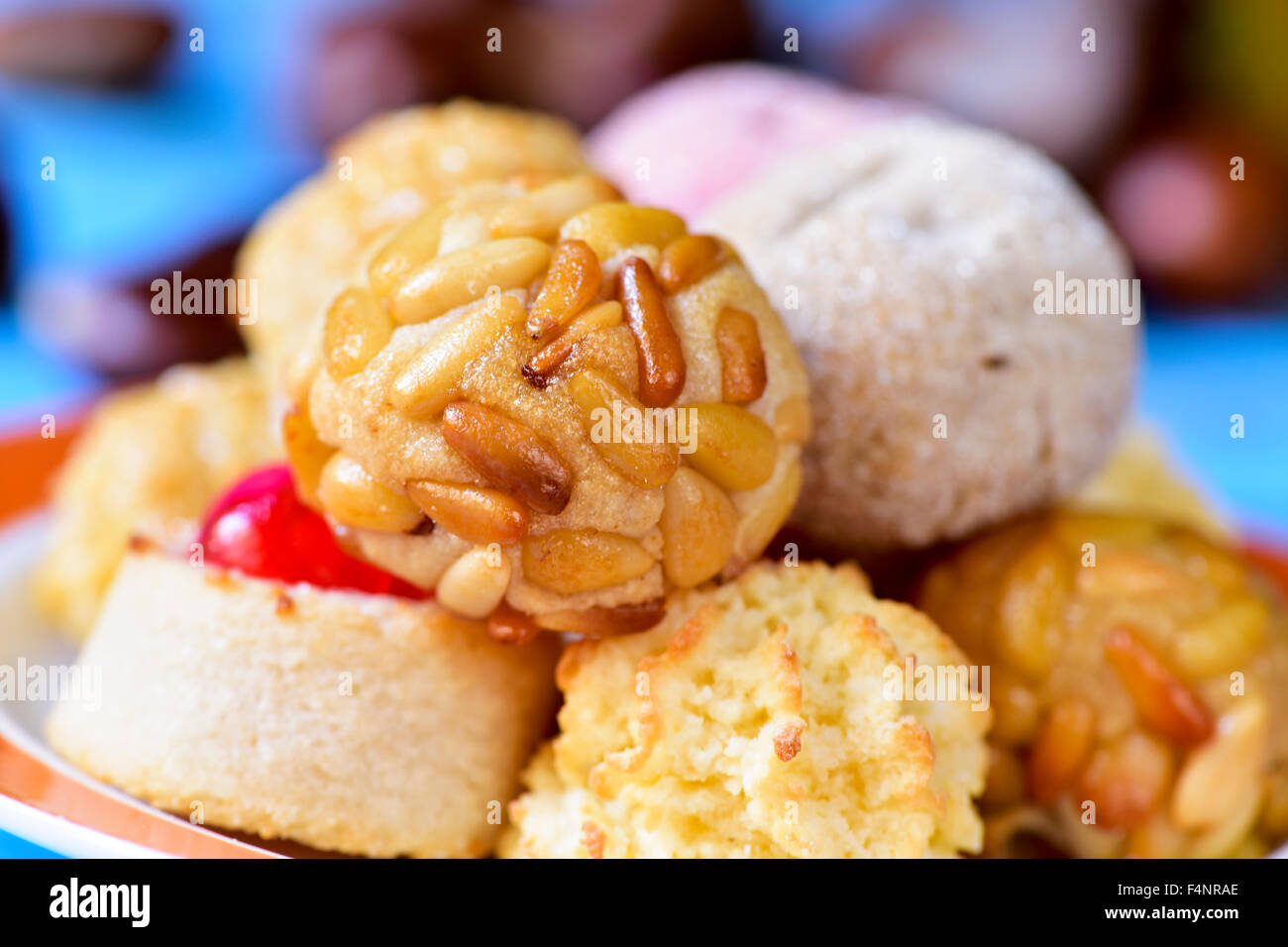 closeup of a plate with some different panellets, typical pastries of ...