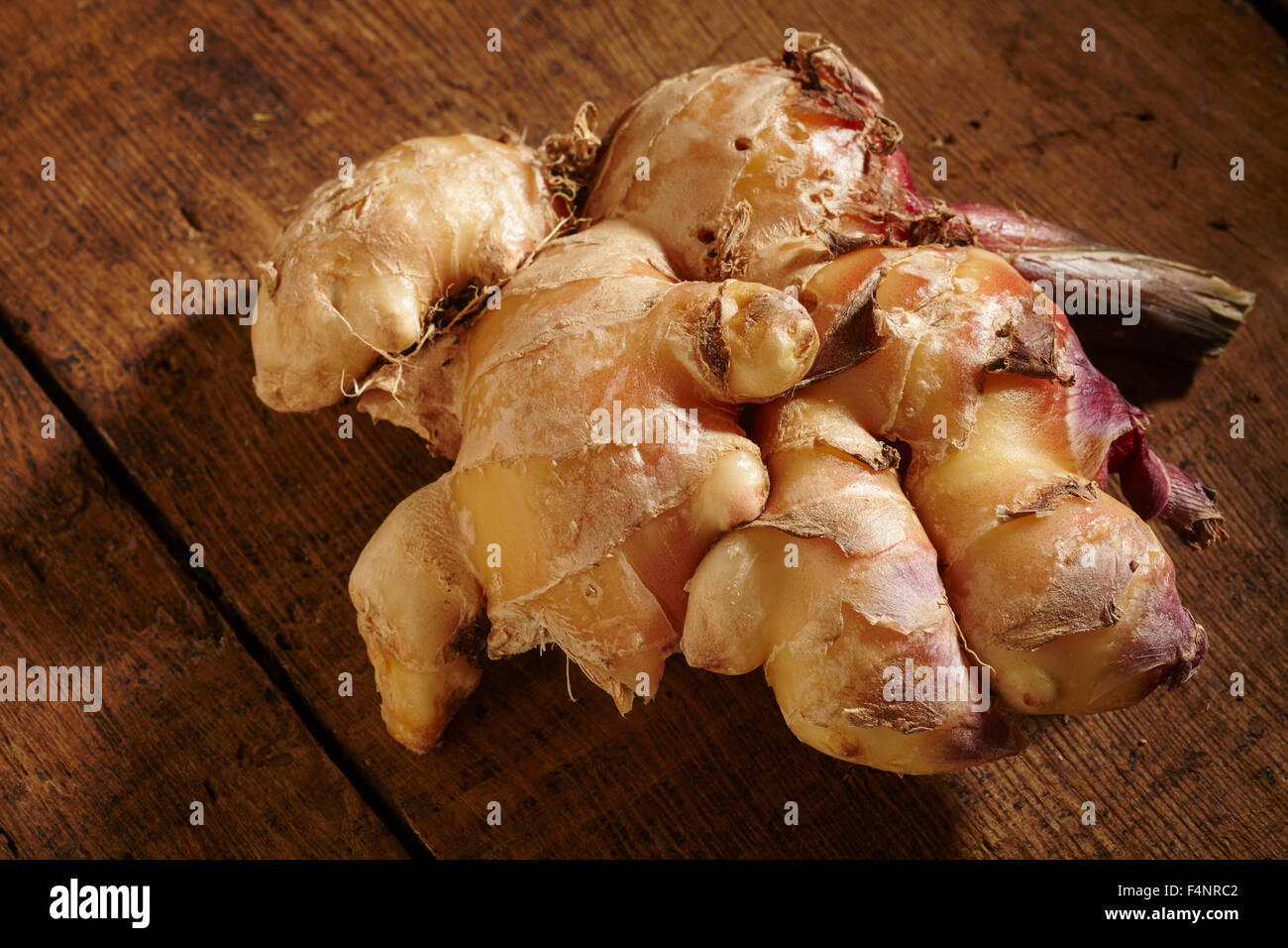 A whole young fresh ginger root Stock Photo - Alamy