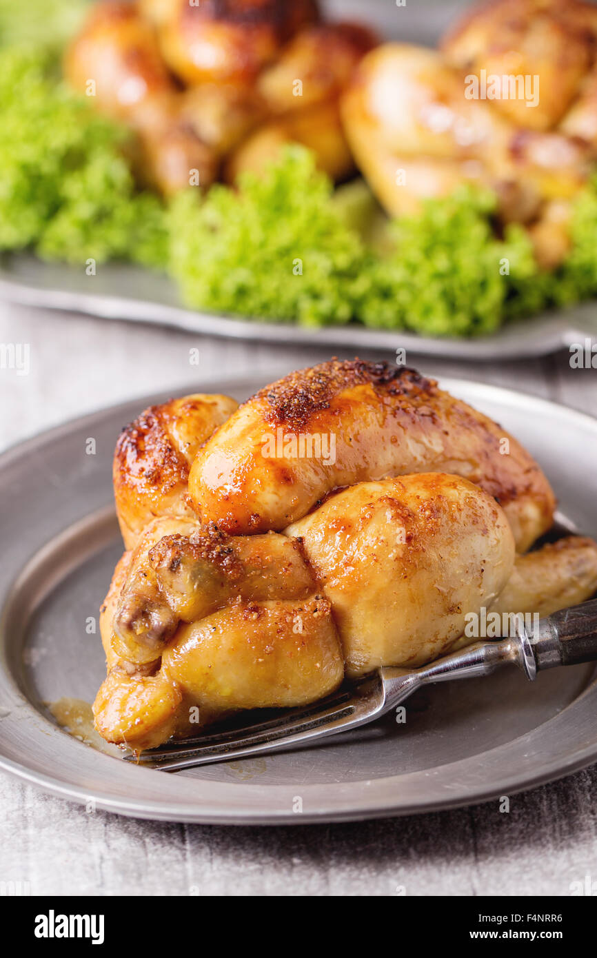 Whole Grilled mini chicken Stock Photo - Alamy