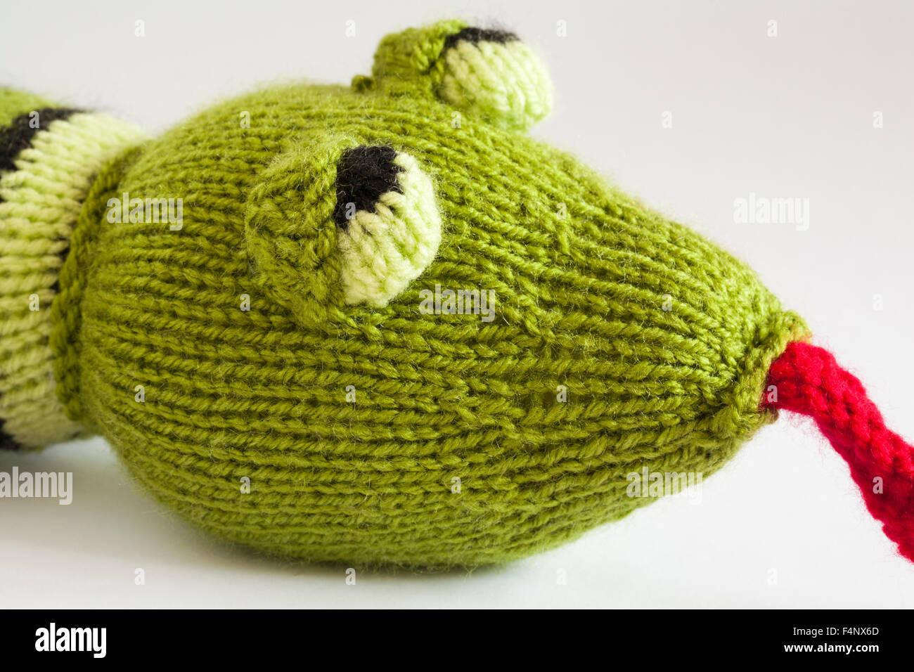 Knitted toy snake set on white background Stock Photo - Alamy