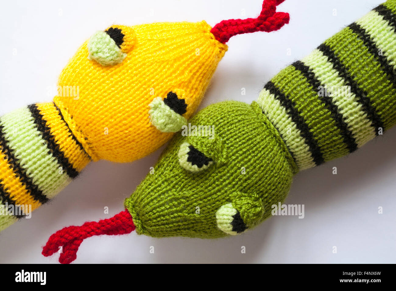 Knitted toy snakes set on white background Stock Photo - Alamy