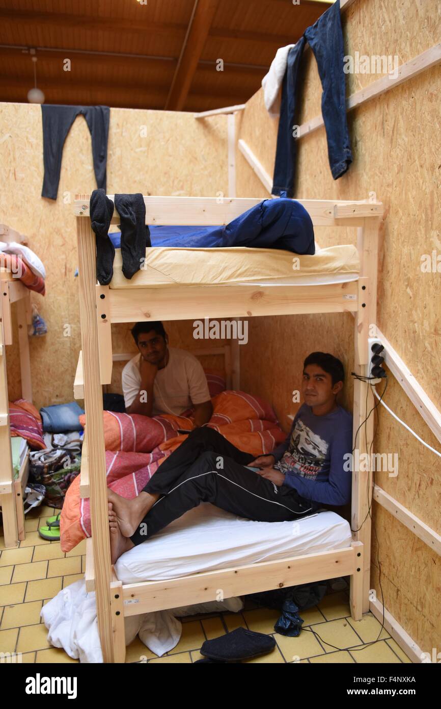 Pakistani refugees sit on a bunk bed in the refugee initial reception ...