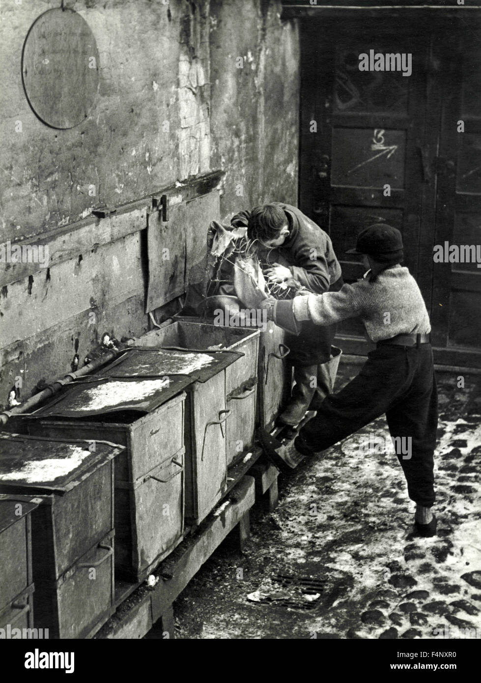 Children rummage in the rubbish bins during the war Stock Photo - Alamy