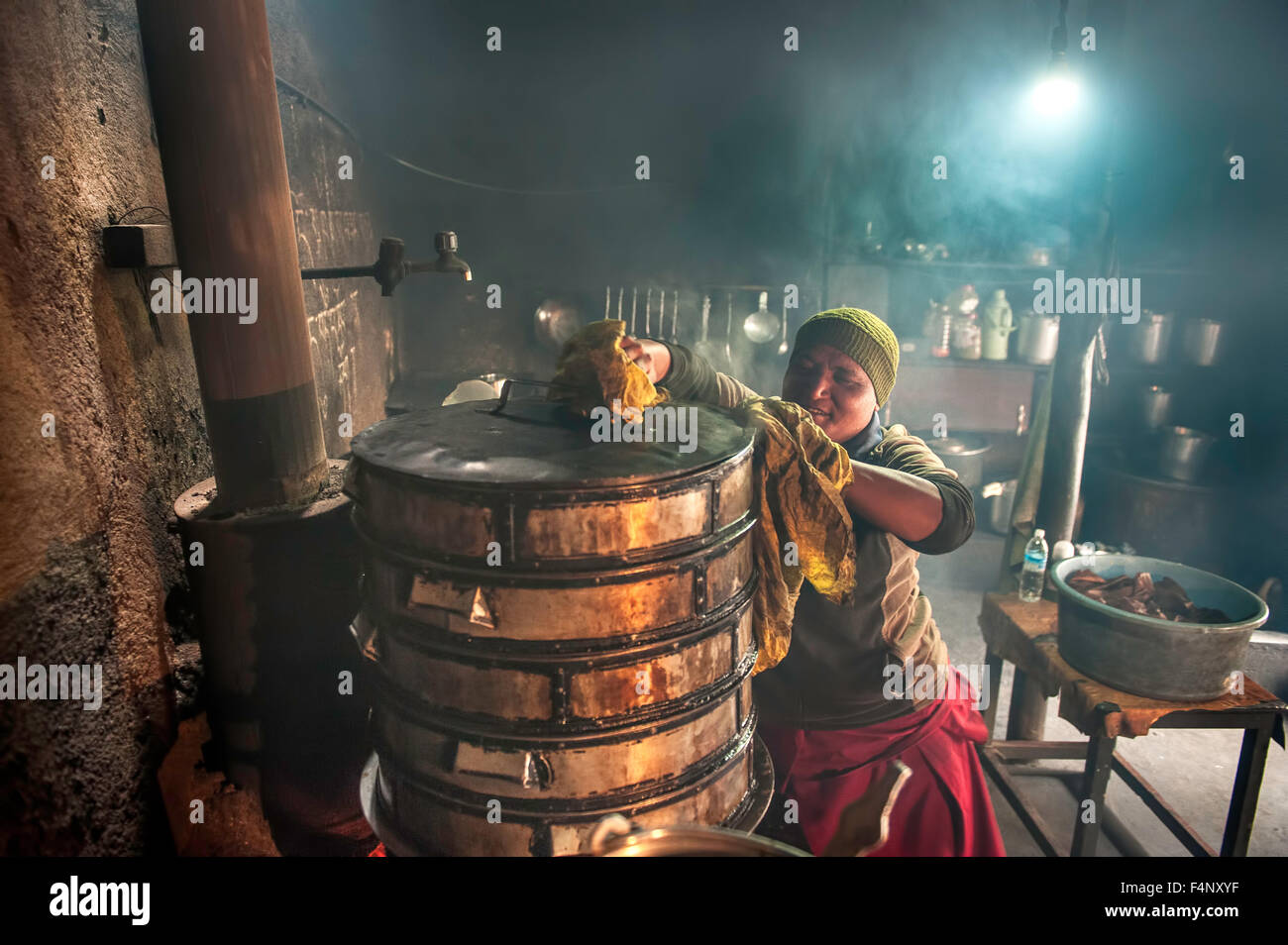 Monk is preparing Tibetan food in kitchen Stock Photo - Alamy