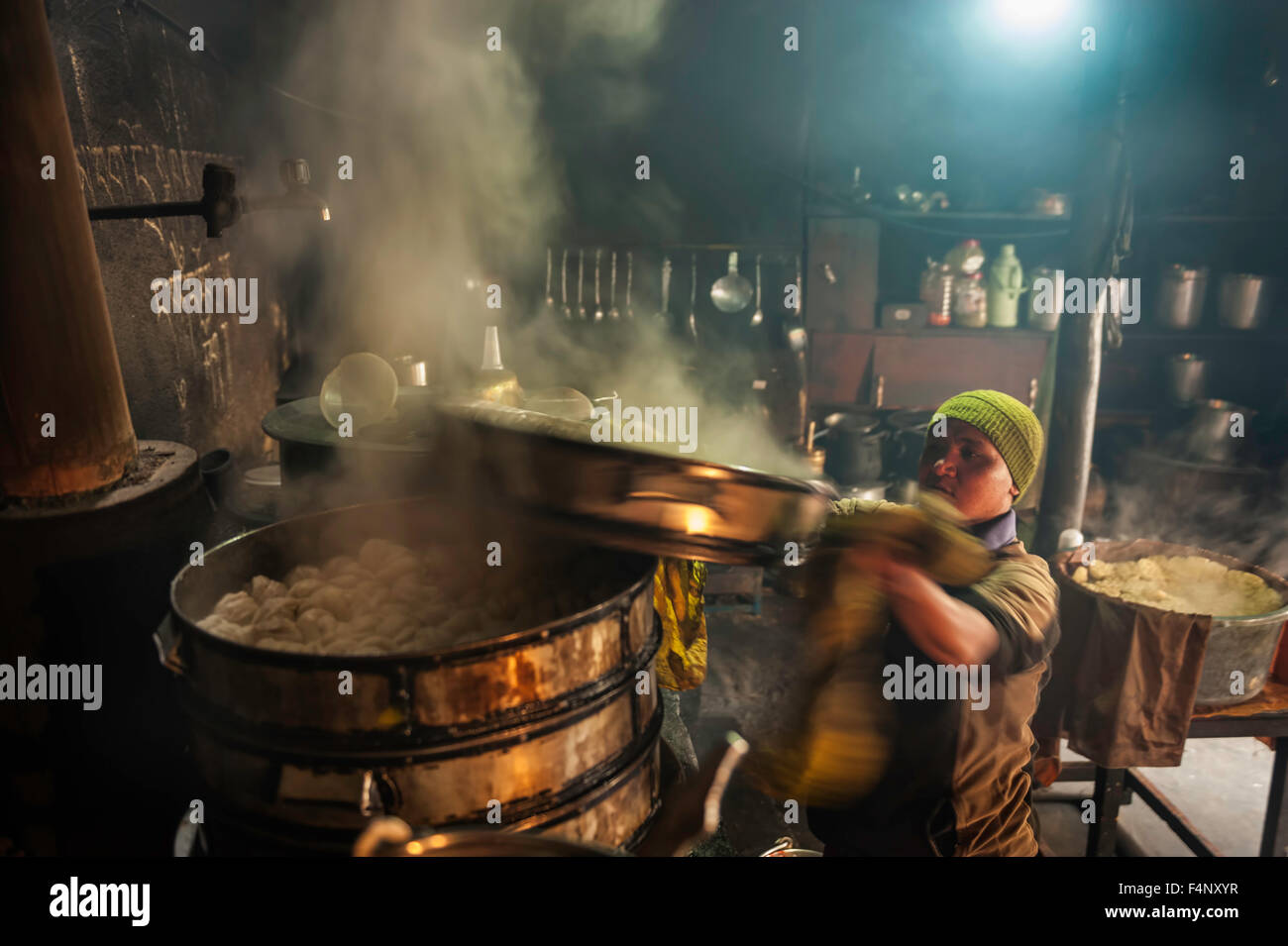 Monk is preparing Tibetan food in kitchen Stock Photo - Alamy