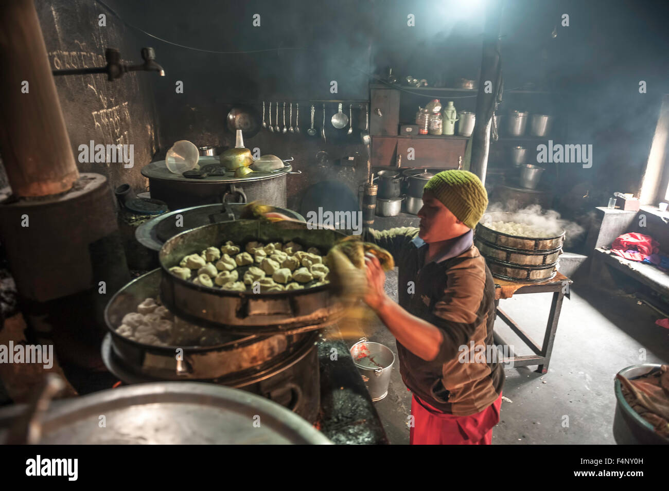 Monk is preparing Tibetan food in kitchen Stock Photo - Alamy