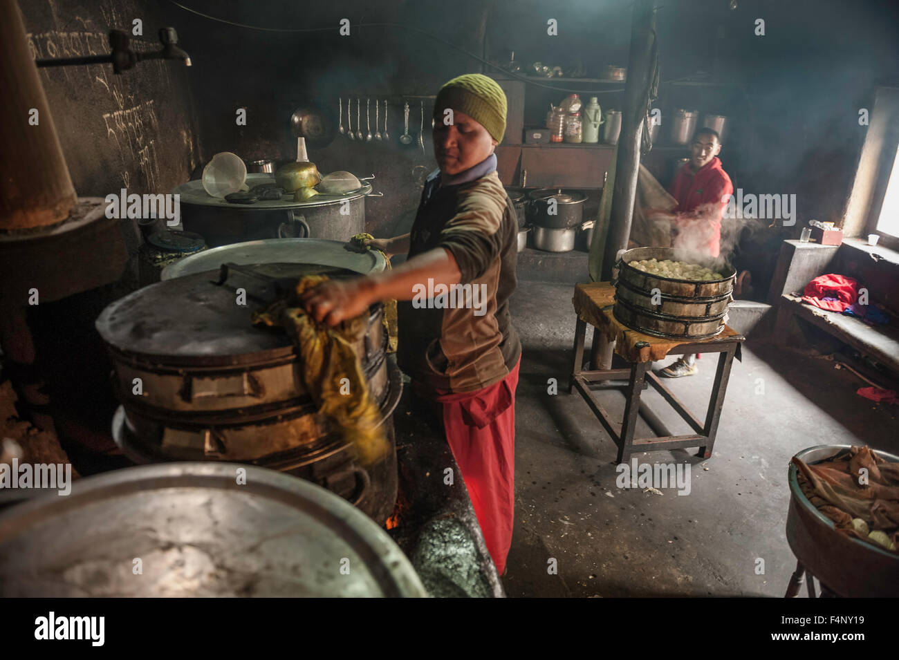 Monk is preparing Tibetan food in kitchen Stock Photo - Alamy
