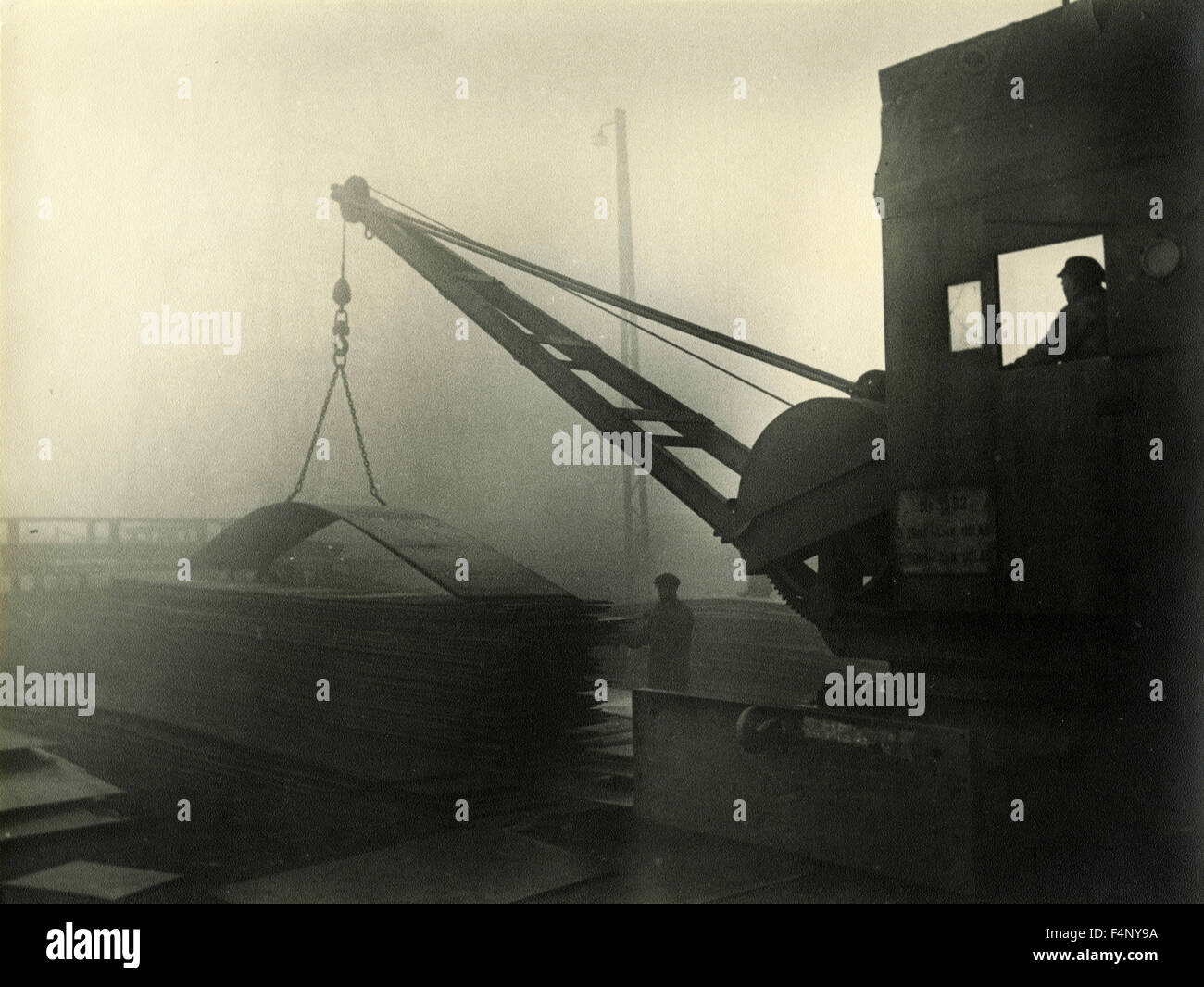 A crane maneuvered through the fog Stock Photo - Alamy