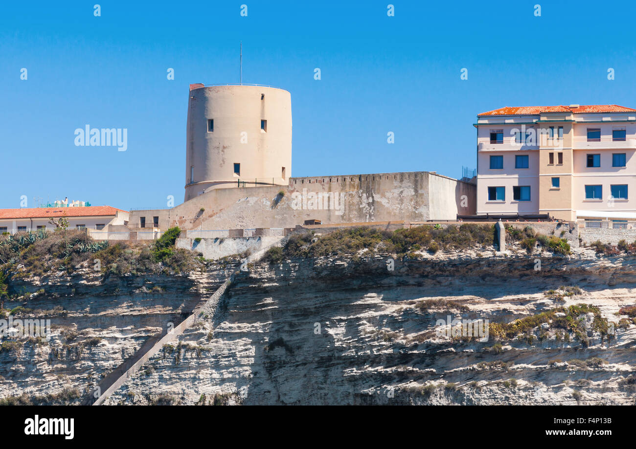 Old fort tower on the rocky coast. Bonifacio, Corsica island, France ...