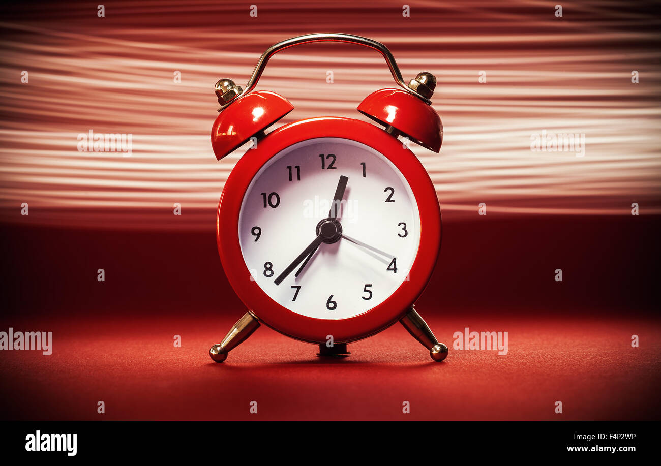 Details of an old red watch on red background Stock Photo - Alamy