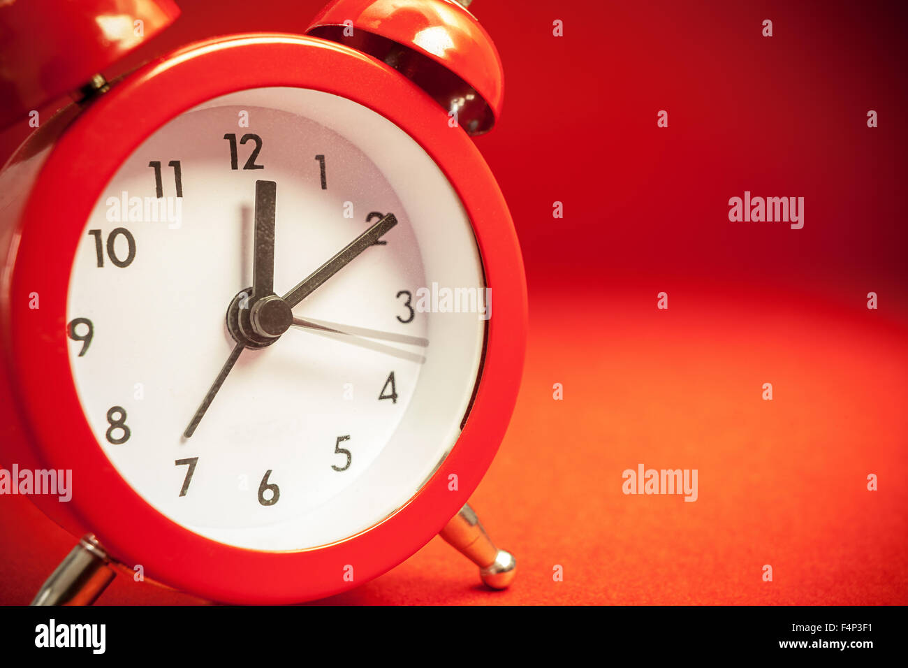Details of an old red watch on red background Stock Photo - Alamy
