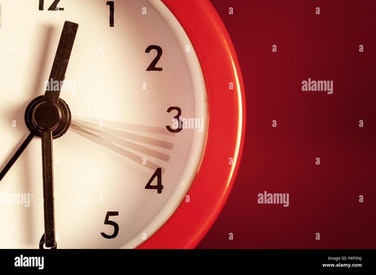 Details of an old red watch on red background Stock Photo - Alamy