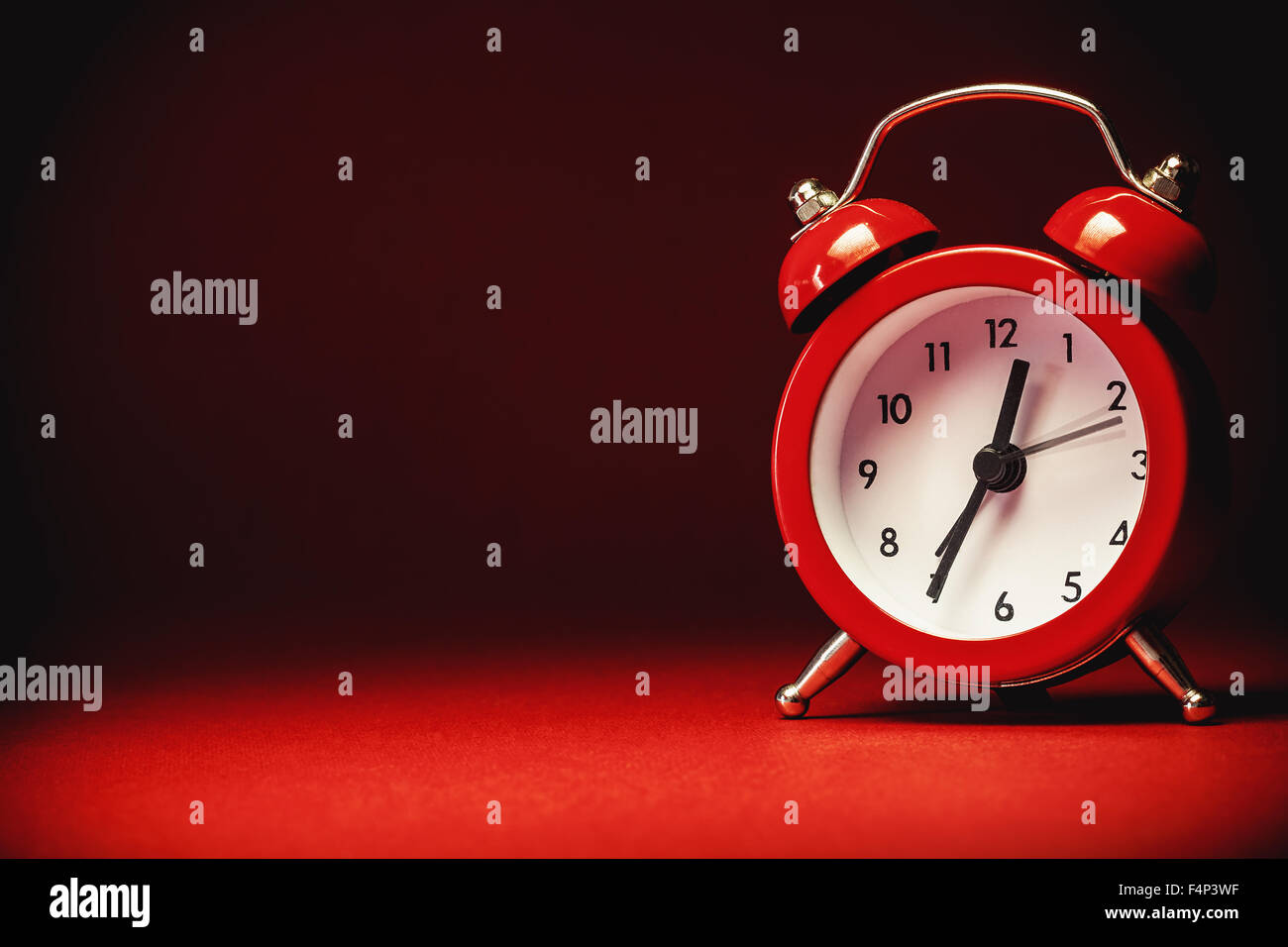 Details of an old red watch on red background Stock Photo - Alamy
