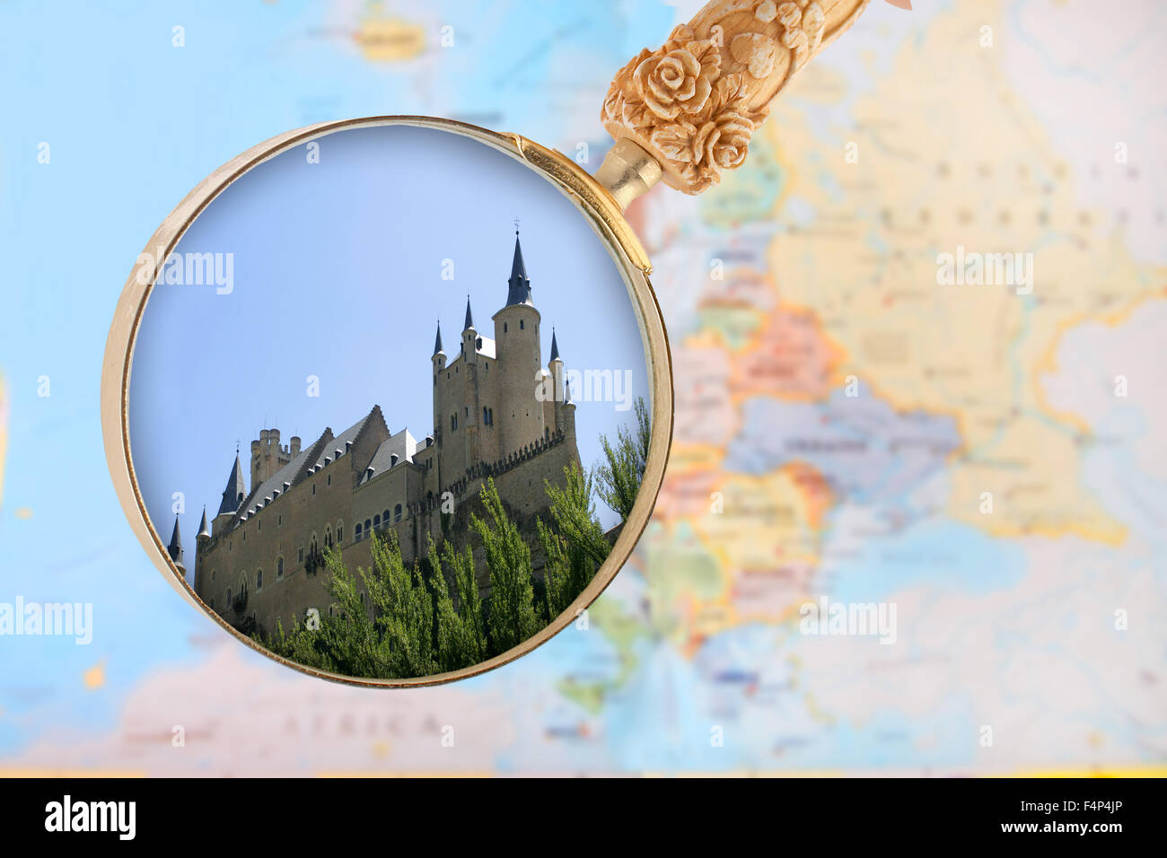 Looking in on the Alcazar in Segovia, Spain with blurred map of Europe ...
