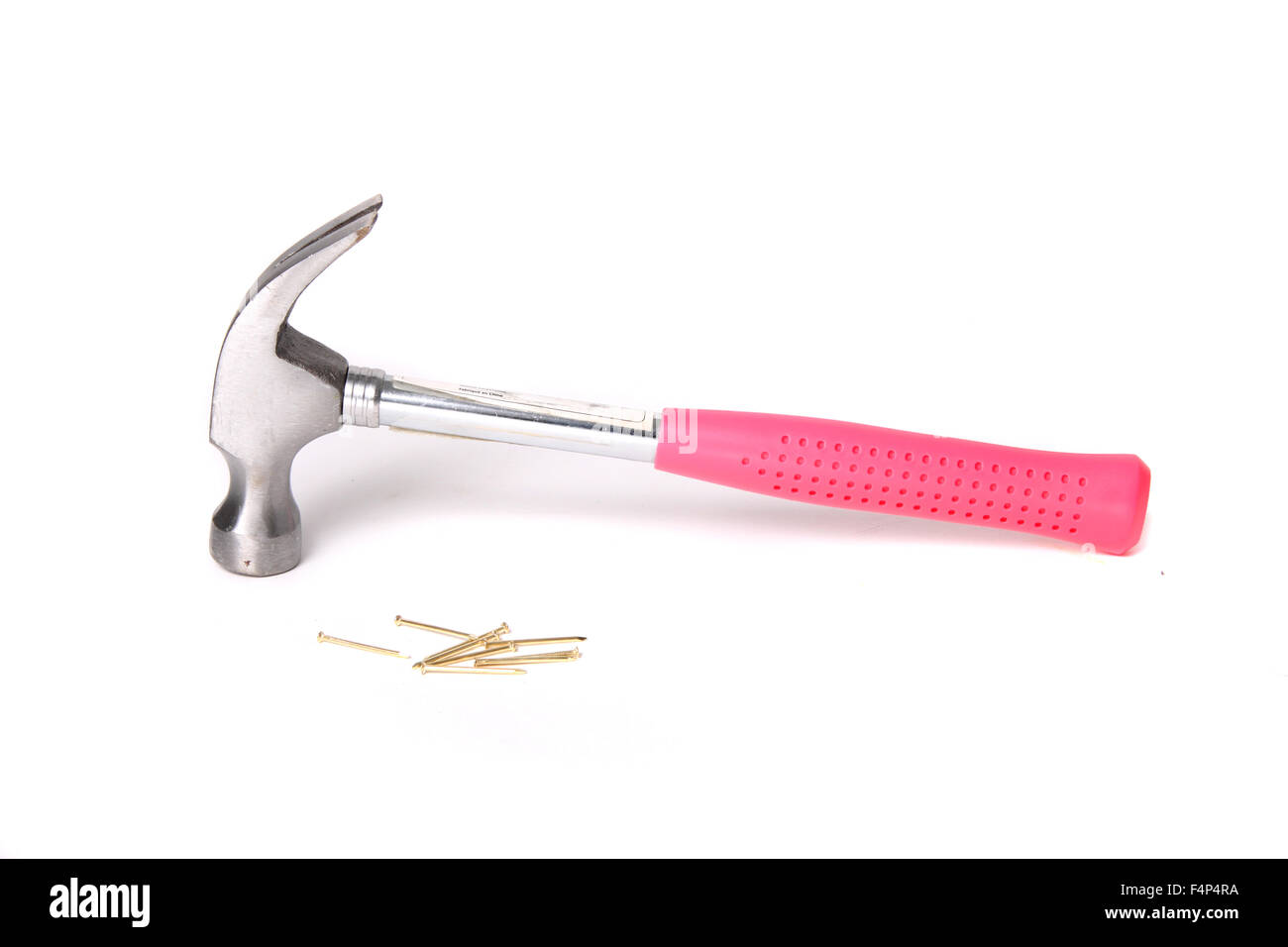 Pink hammer and golden nails on a white background Stock Photo - Alamy