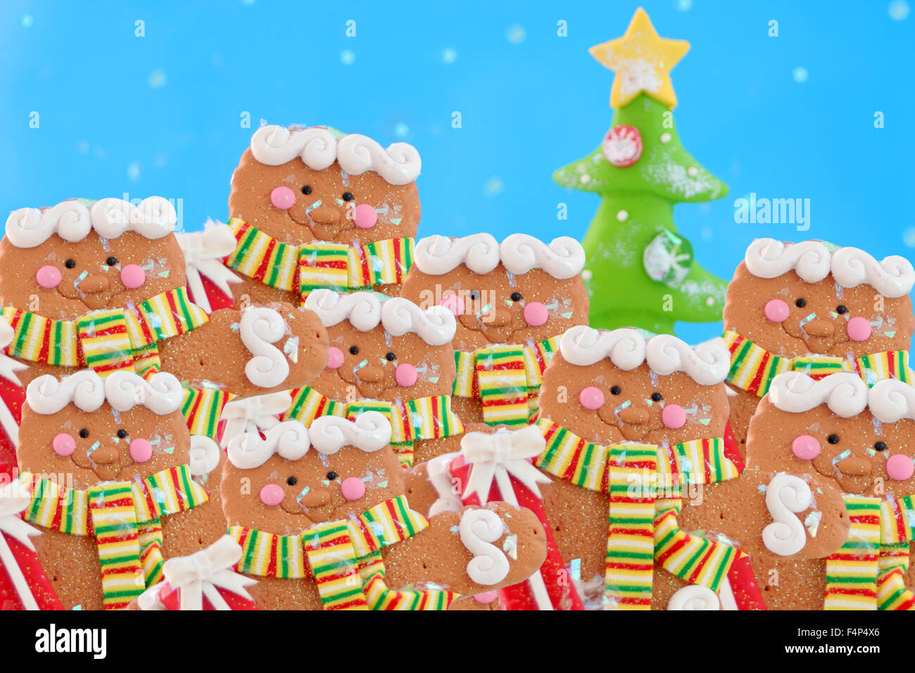 Pack of gingerbread men cookies in a winter wonderland wearing a scarf ...