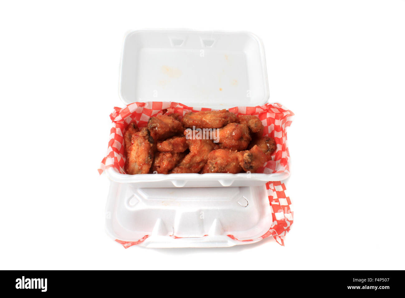 Take out thai chilli chicken wings in package on a white background ...