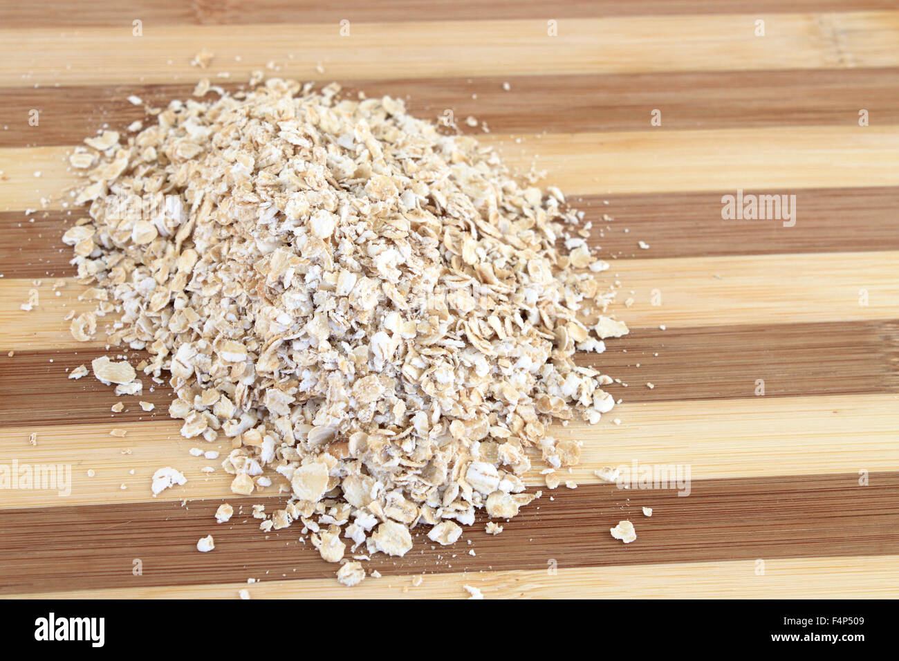 Serving of dry Oatmeal on a wooden board ready for cooking Stock Photo ...
