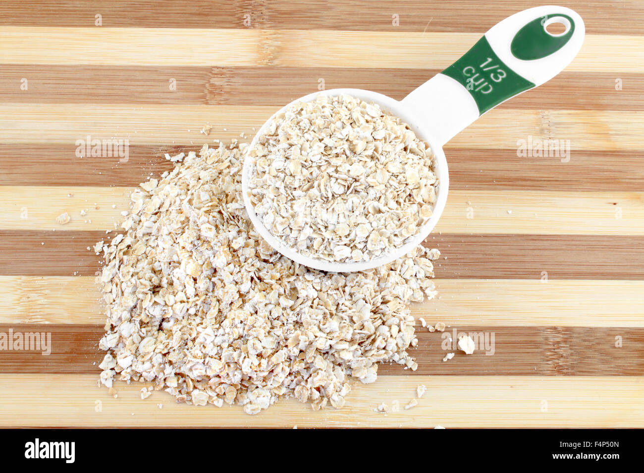 Serving of dry Oatmeal in a measuring cup ready for cooking Stock Photo ...