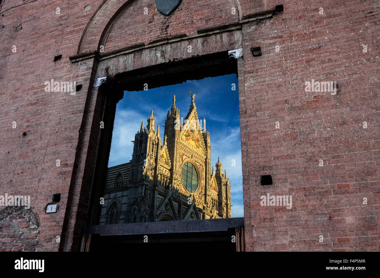 The magnificent cathedral of Siena reflected on a glass Stock Photo - Alamy