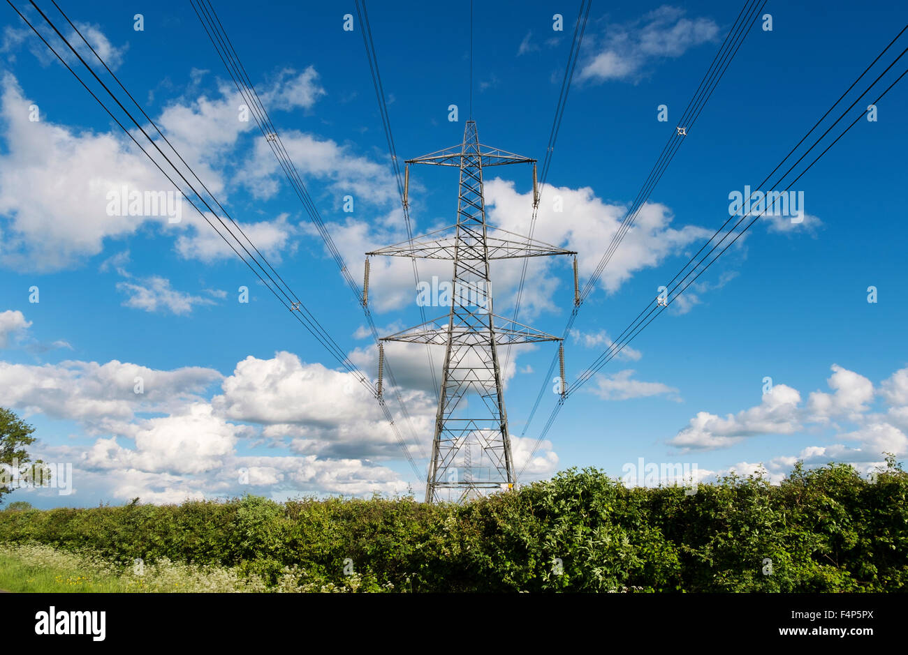 Pylon carrying electricity cables over the countryside in the Cotswolds ...
