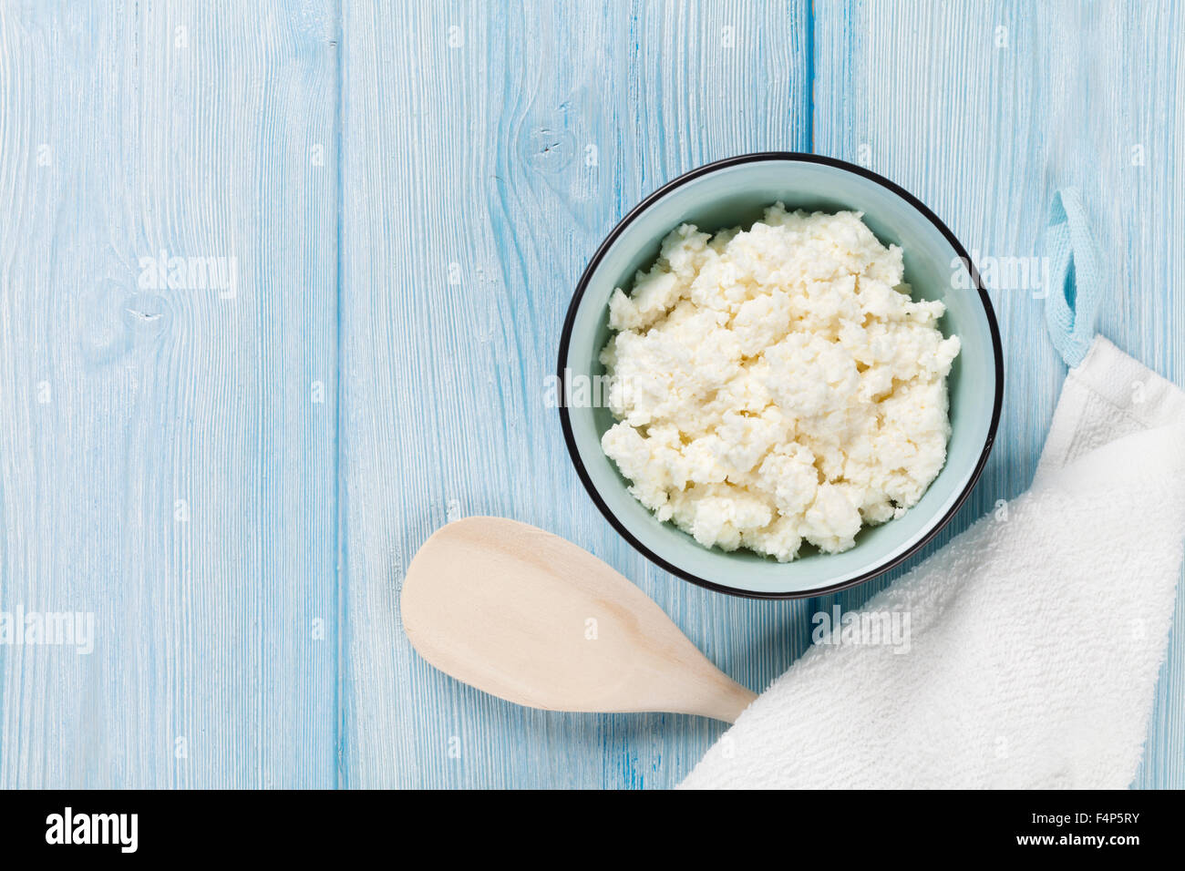 Dairy products on wooden table. Homemade cheese curd. Top view with ...