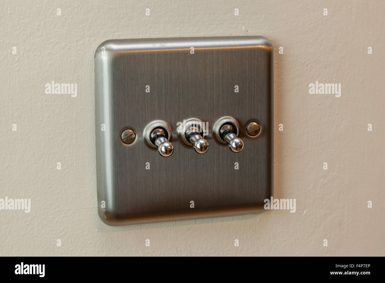 A silver light switch Stock Photo - Alamy
