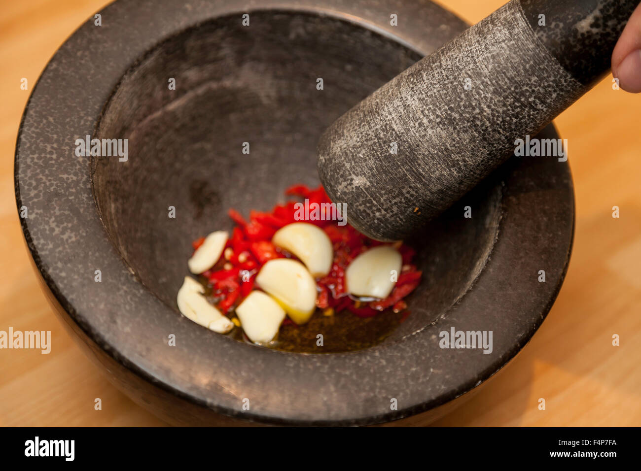 Pestle and Mortar with Chili and Garlic Stock Photo - Alamy