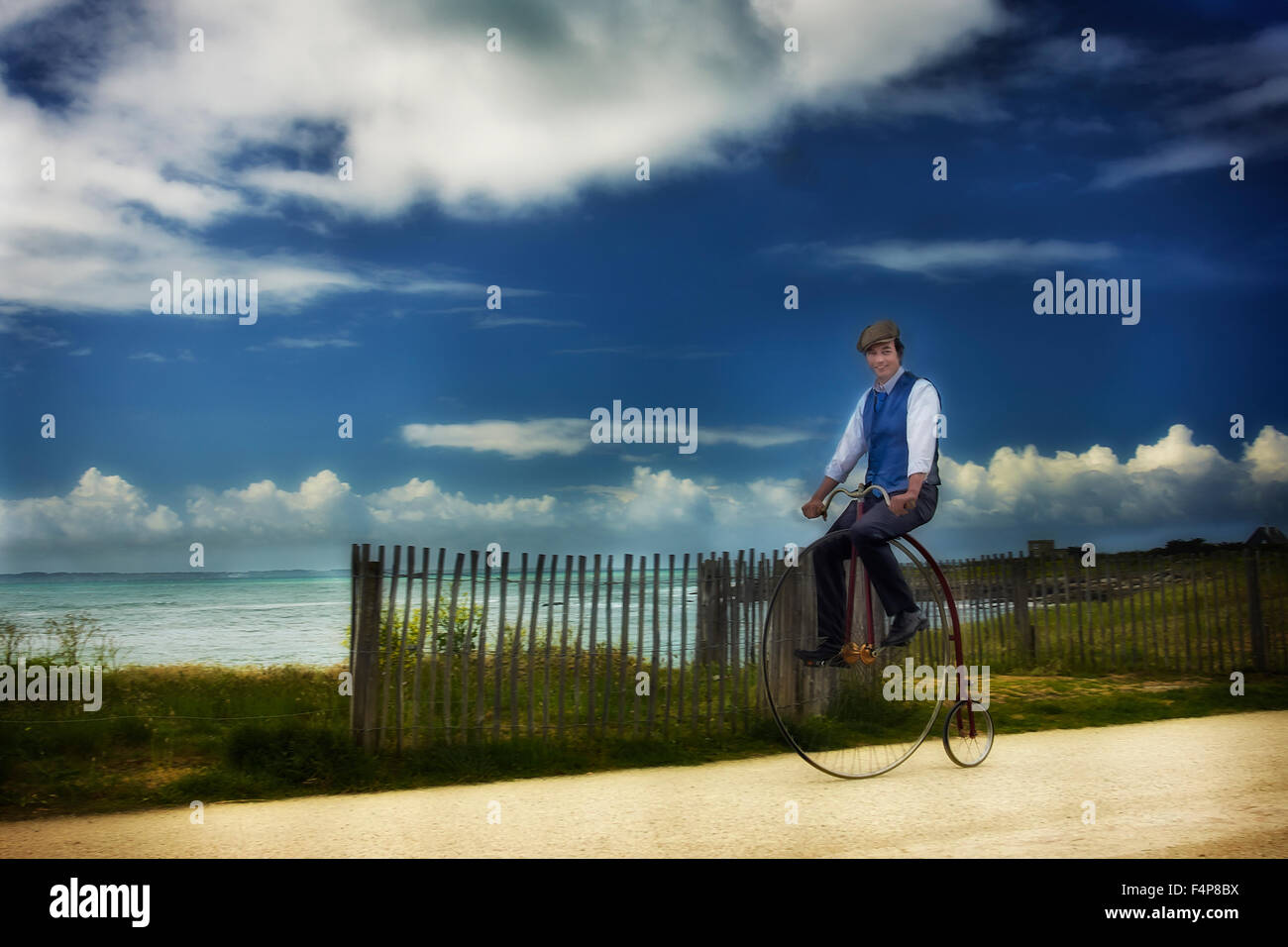 Male riding on Penny Farthing Stock Photo - Alamy