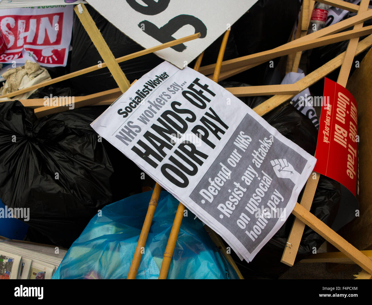 Leftover placards and signs from a protest about the NHS in London ...