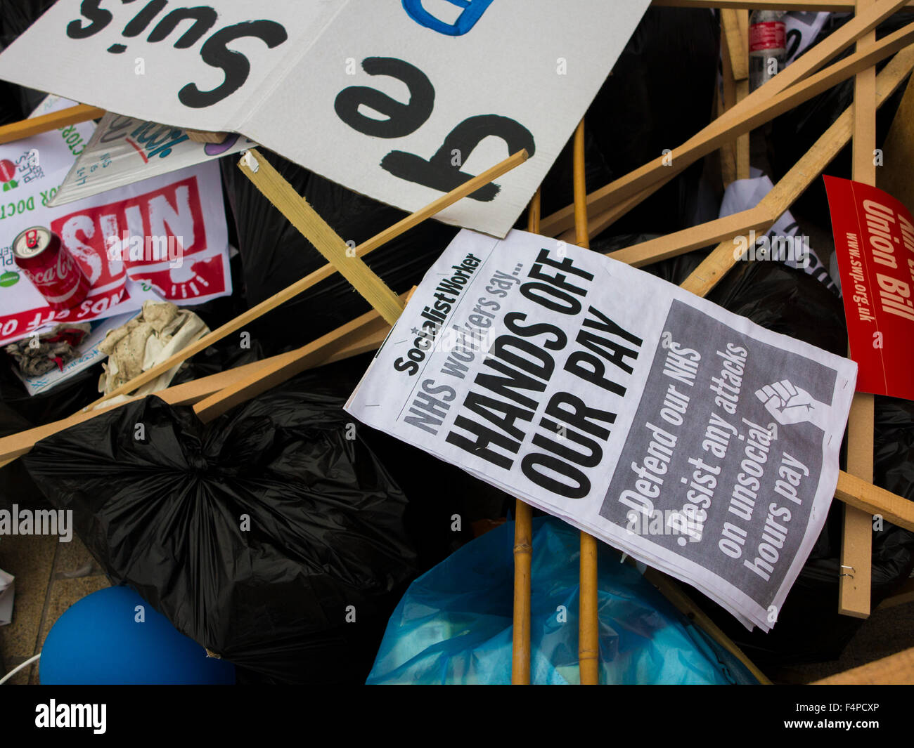 Leftover placards and signs from a protest about the NHS in London ...