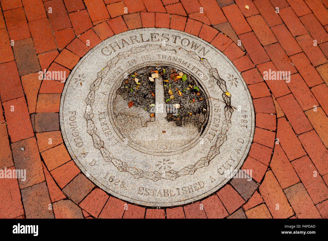 A commemorative marker in the ground in Charlestown neighborhood ...