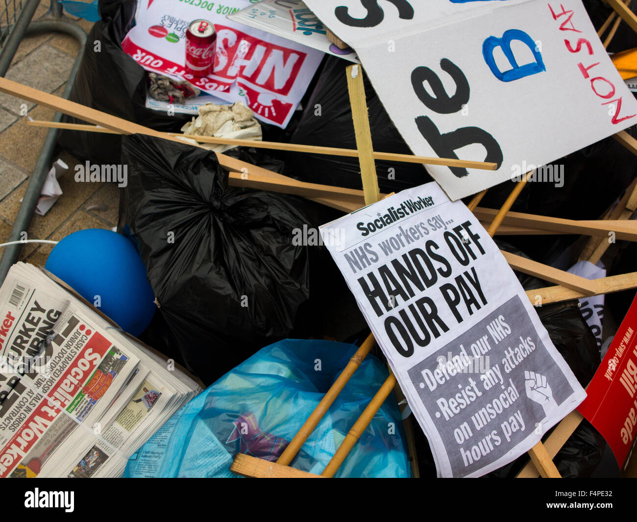 Leftover placards and signs from a protest about the NHS in London ...
