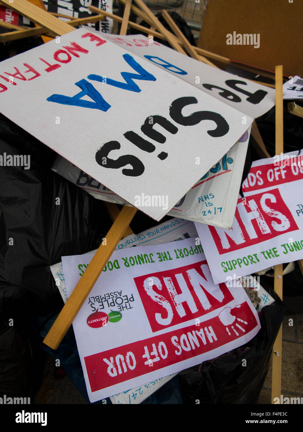 Leftover placards and signs from a protest about the NHS in London ...