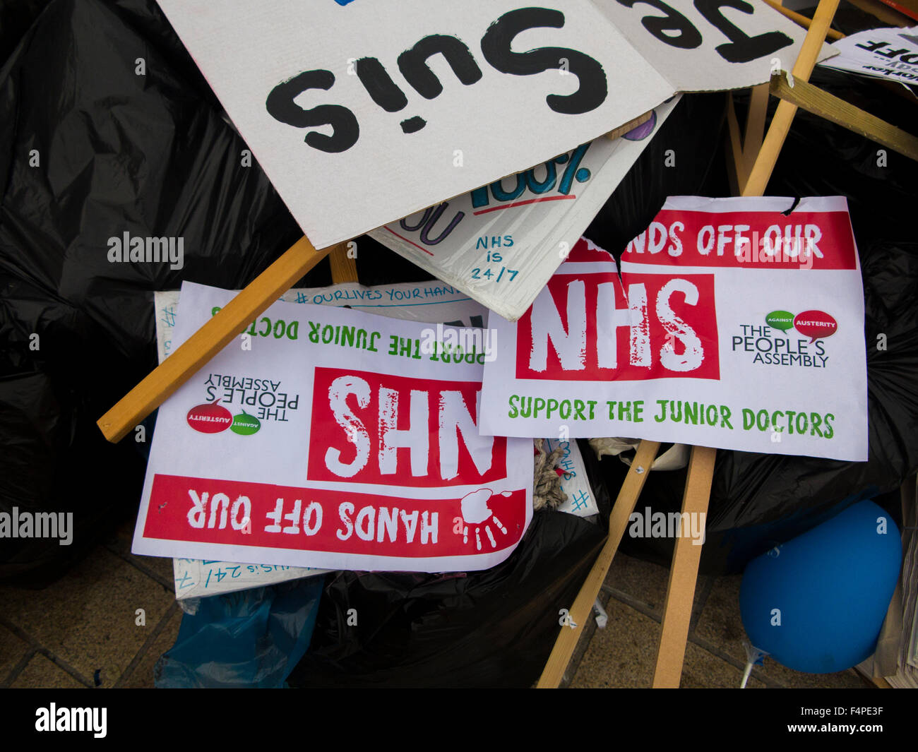 Leftover placards and signs from a protest about the NHS in London ...