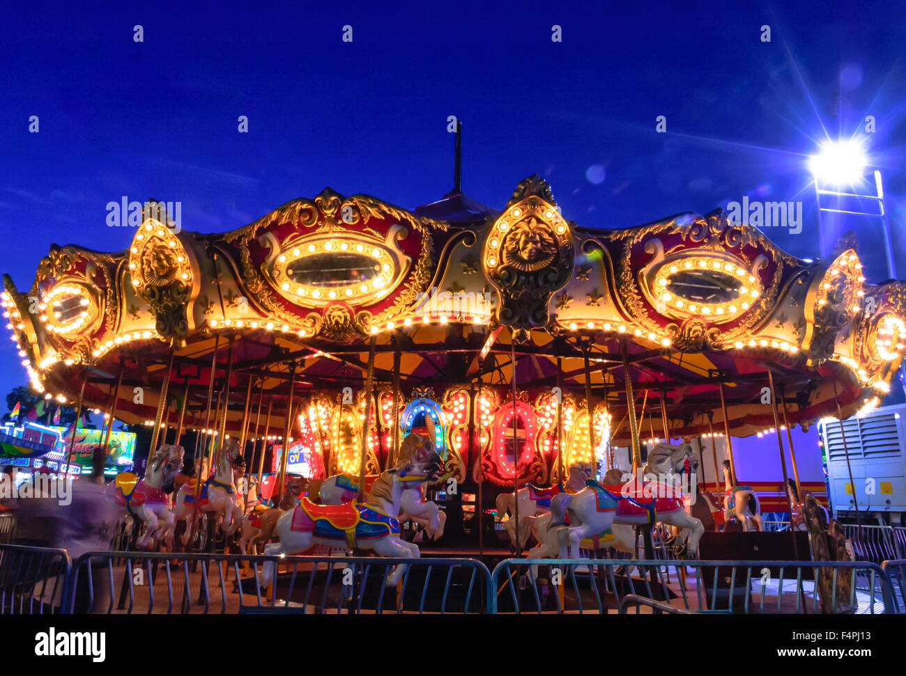 Merry Go Round Rides on the blue sky background Stock Photo - Alamy