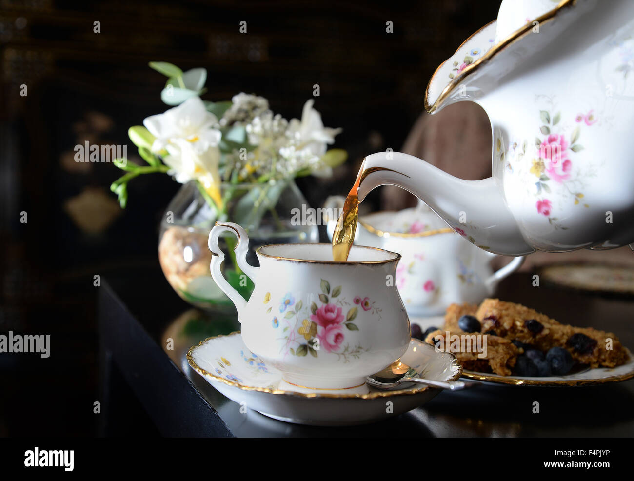 Taking afternoon tea Stock Photo - Alamy