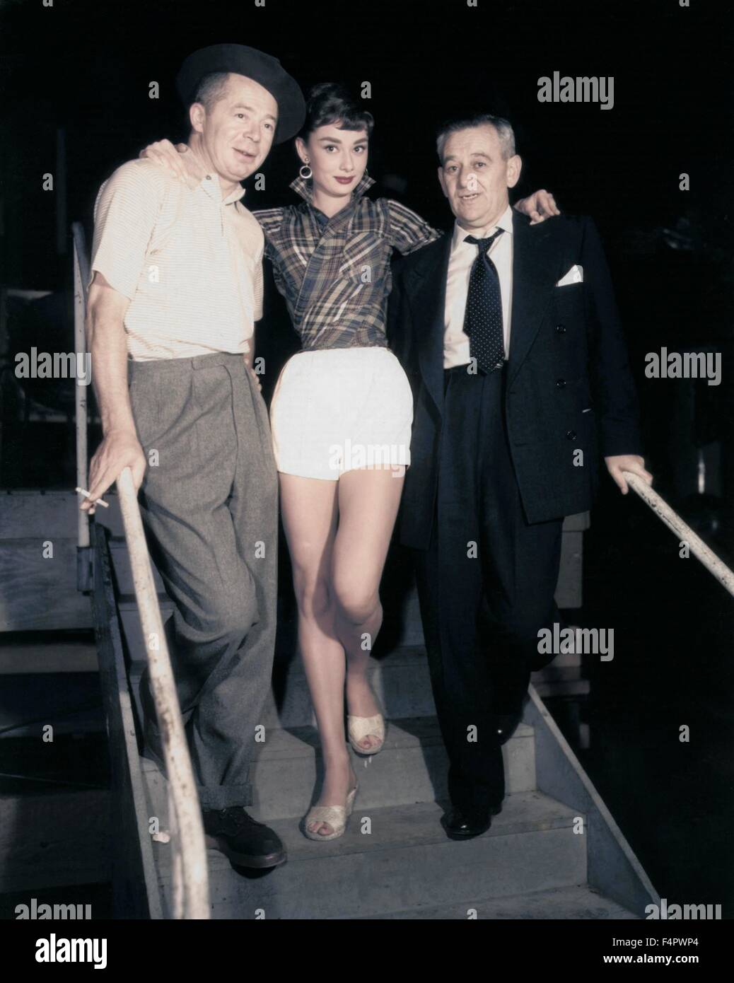 On the set, Audrey Hepburn between Billy Wilder and William Wyler ...