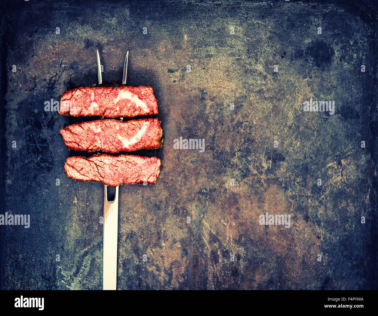 Grilled beef meat on rustic metal background. Food concept. Vintage ...