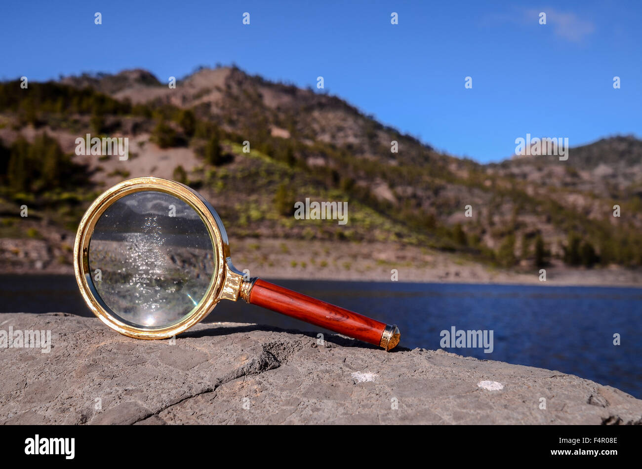 Magnify Glass Loupe on the Volcanic Rock Stock Photo - Alamy