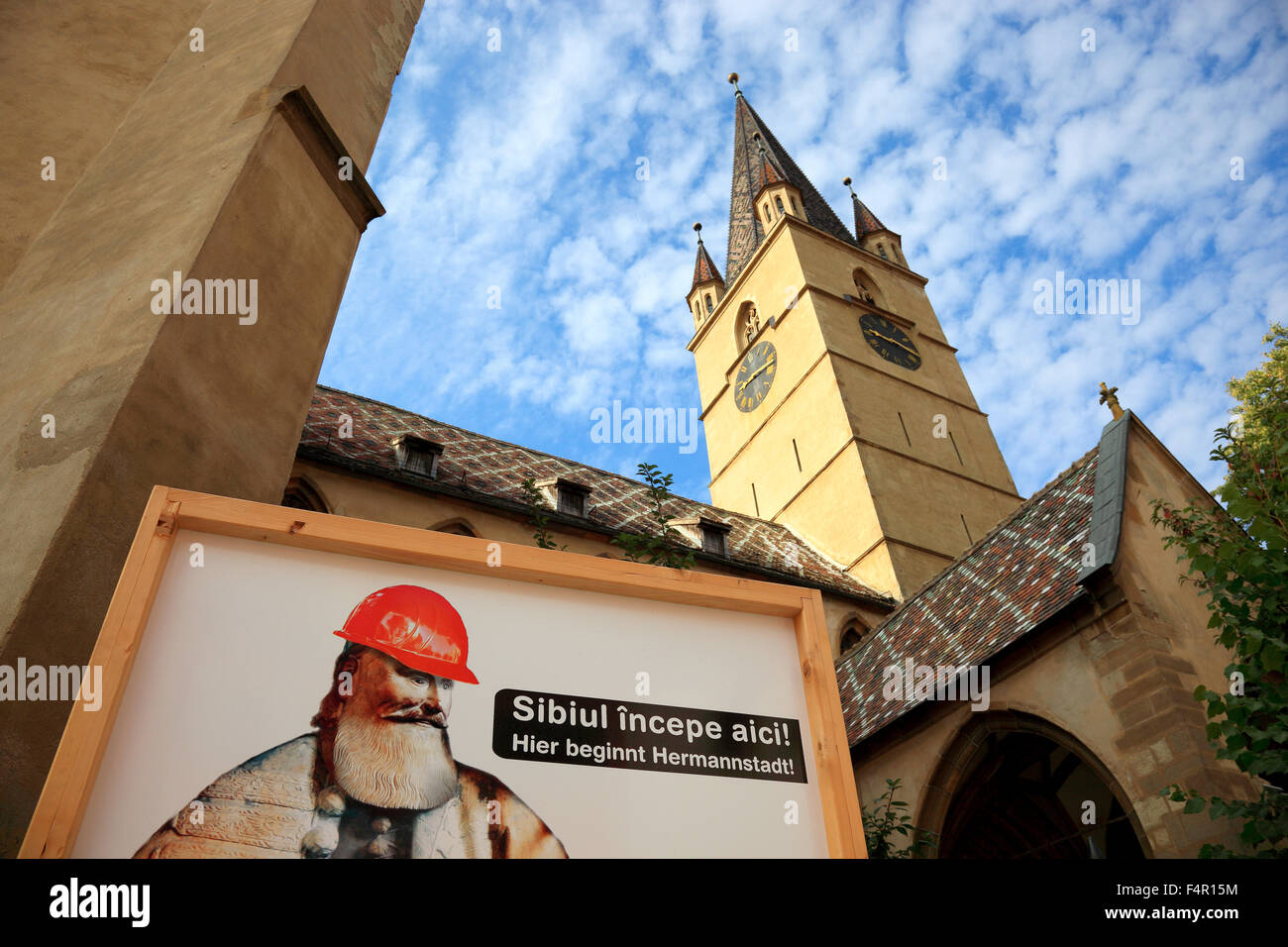 Bilingual construction sign. Here begins Hermannstadt. At the ...