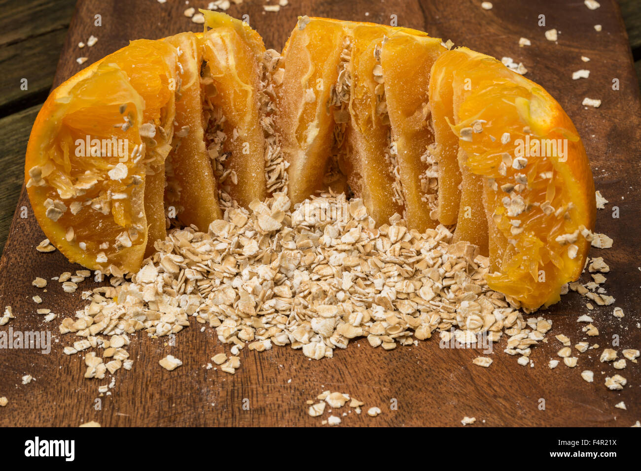 Oatmeal and orange for breakfast - food synergy Stock Photo - Alamy