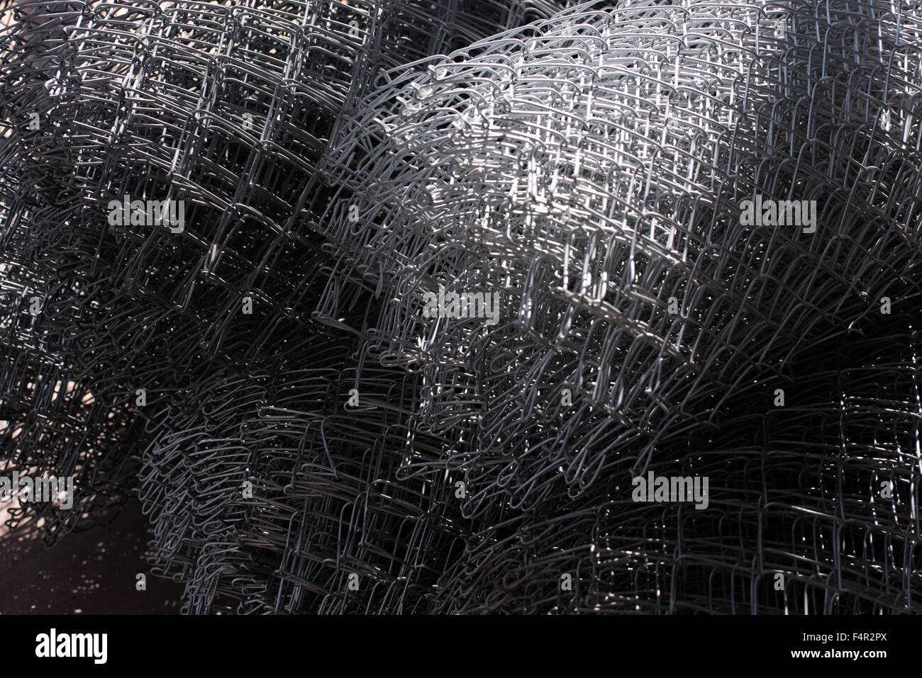 outdoor building materials - rolls of chain link fence Stock Photo - Alamy