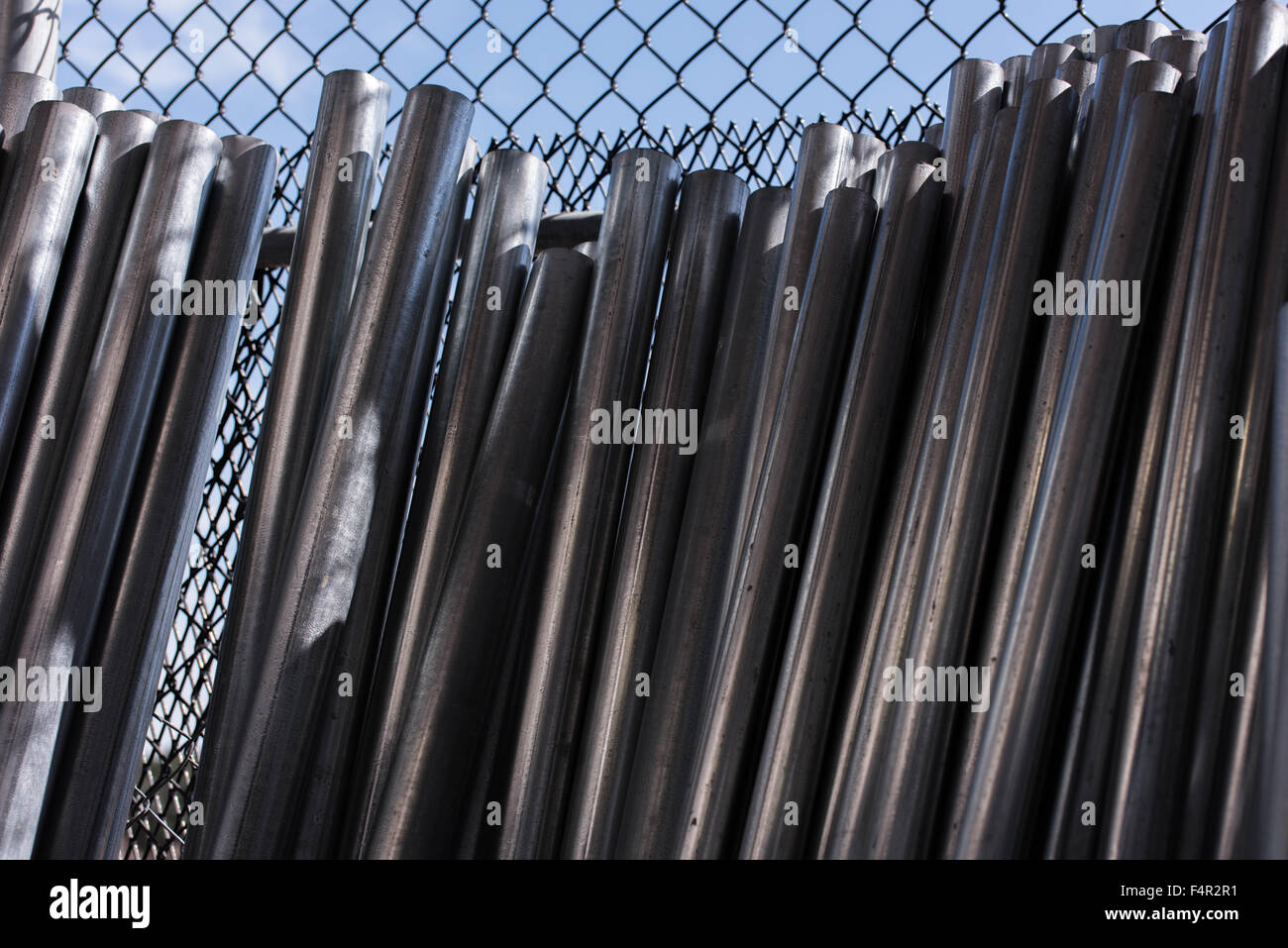 outdoor building materials - stacked chain link fence posts Stock Photo ...