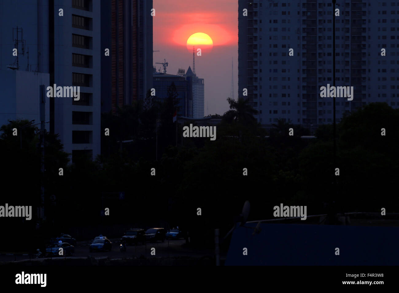 Views of the sun between buildings in the city of Jakarta, Indonesia ...